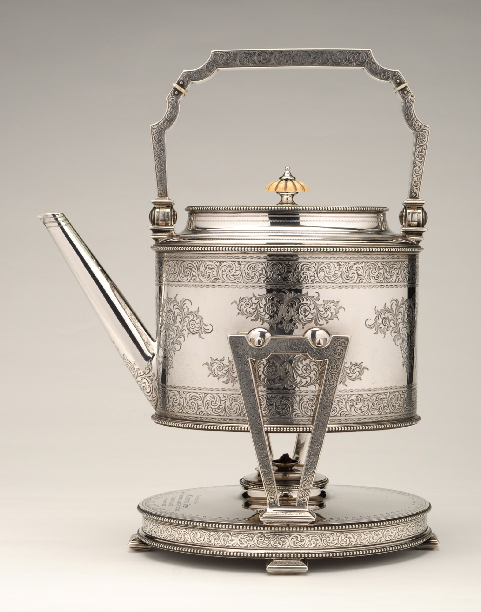 Lot 679 - A Victorian tea kettle-on-stand, probably by