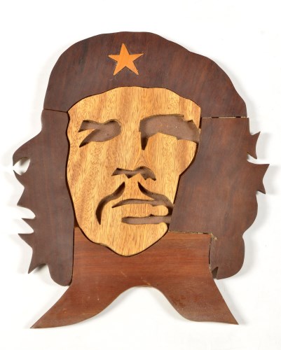 Lot 1249 - A stained wood marquetry plaque of Che