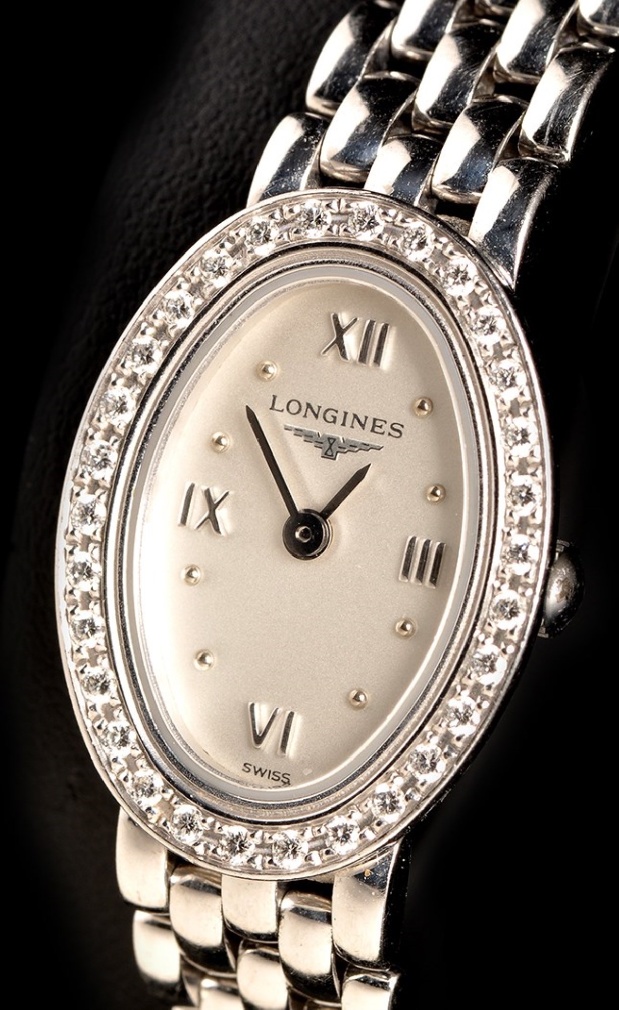 Longines: a lady's 18ct. white gold and - auctions & price archive