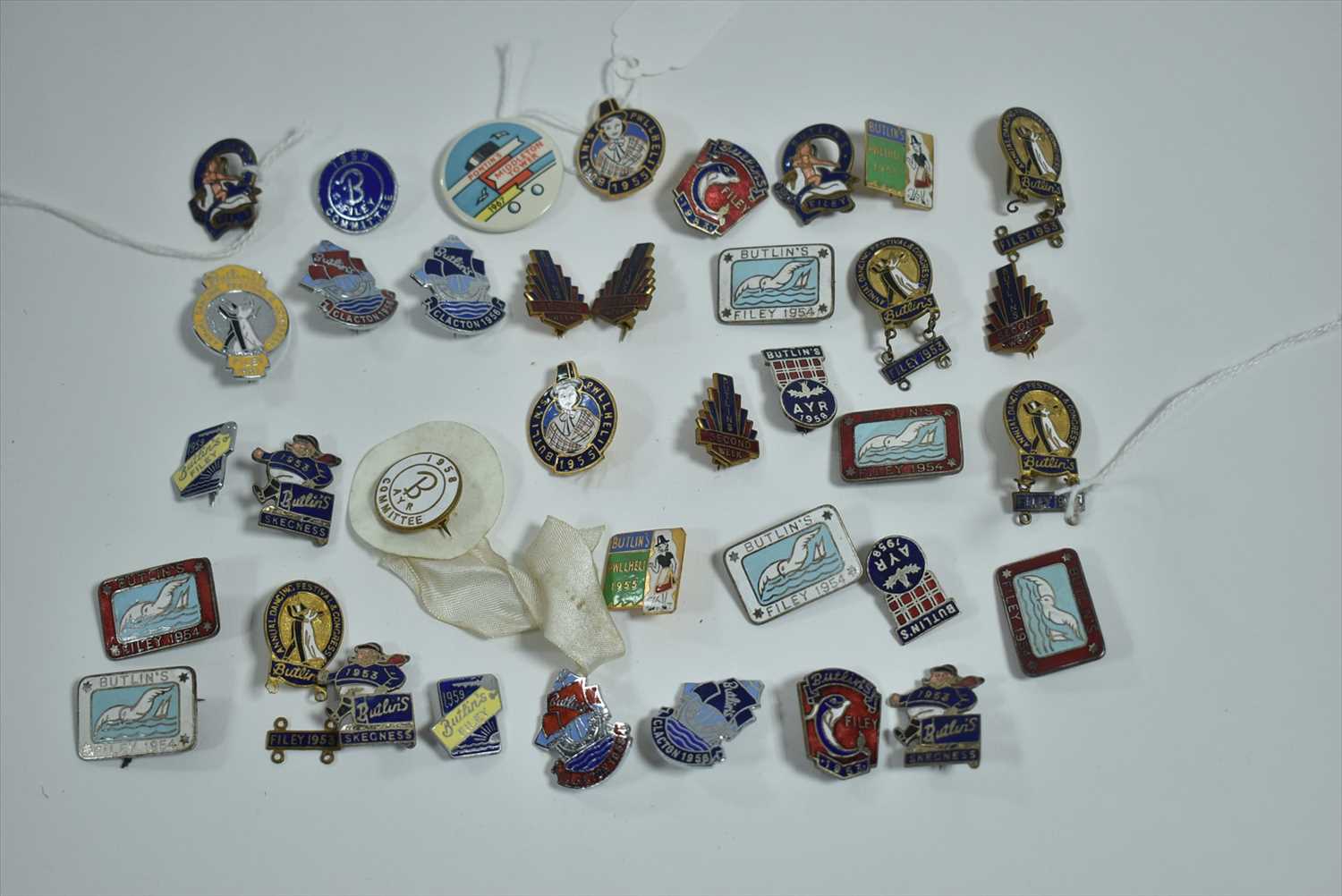 Lot 1099 - Butlins enamel badges