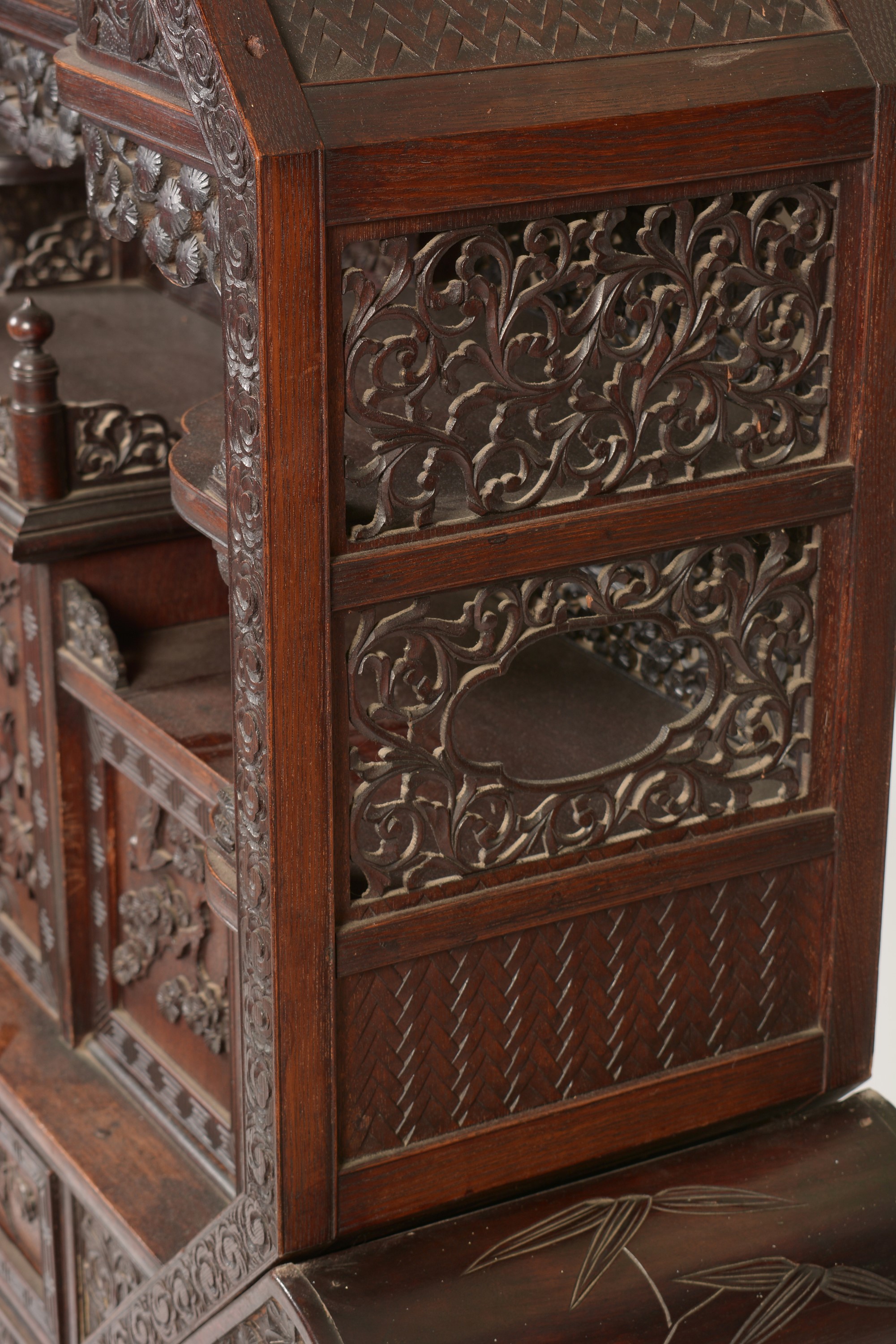 Lot 847 - A Japanese carved netsuke display cabinet.
