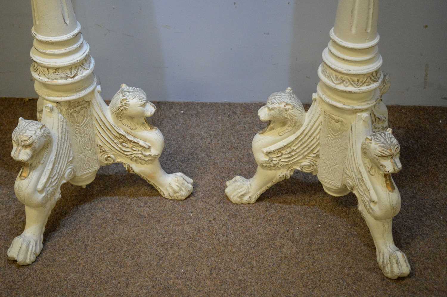 Lot 100 - Pair of 20th C cast iron pricket stands.