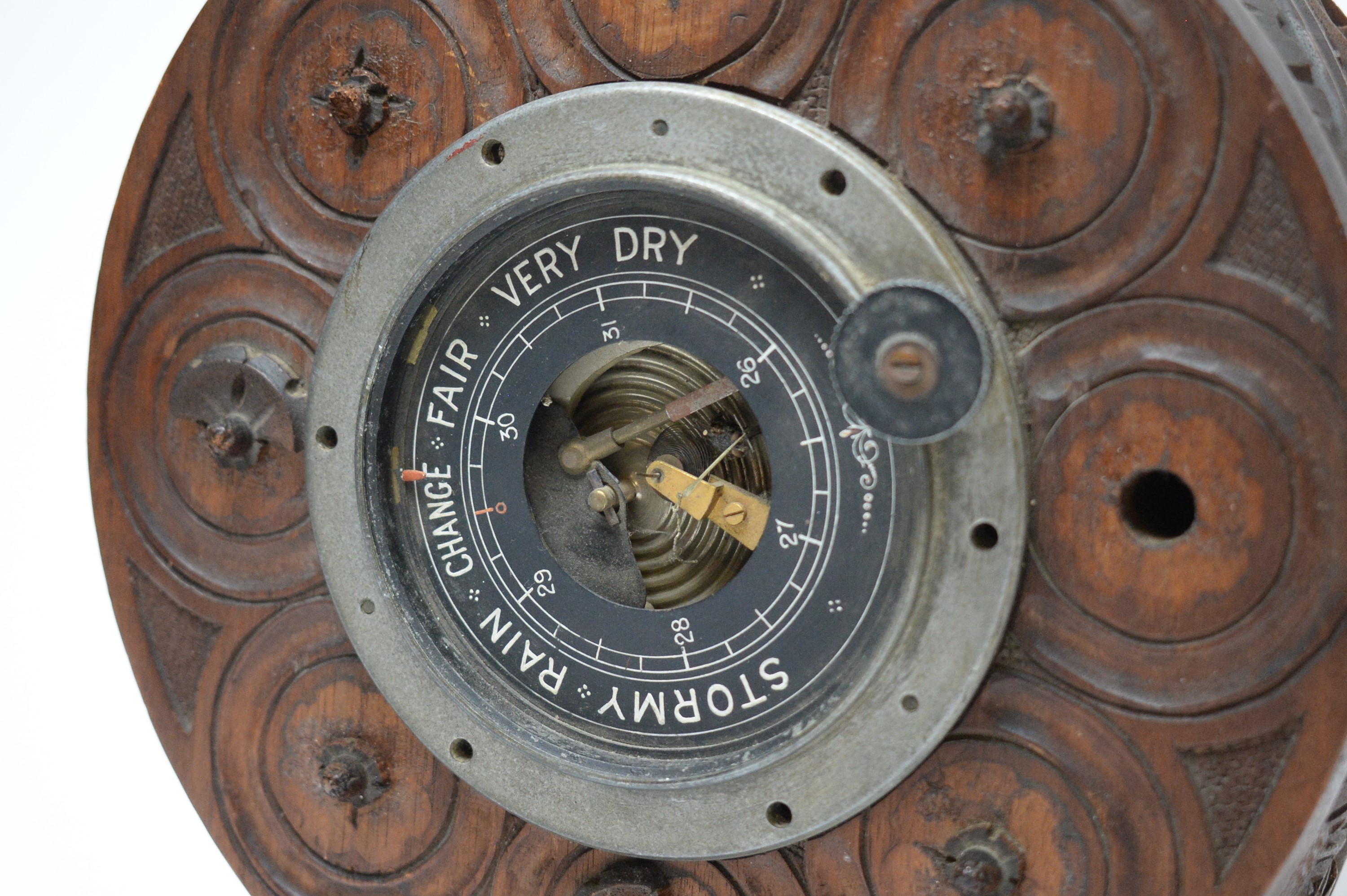 Lot 770 - An aneroid barometer set into the wooden