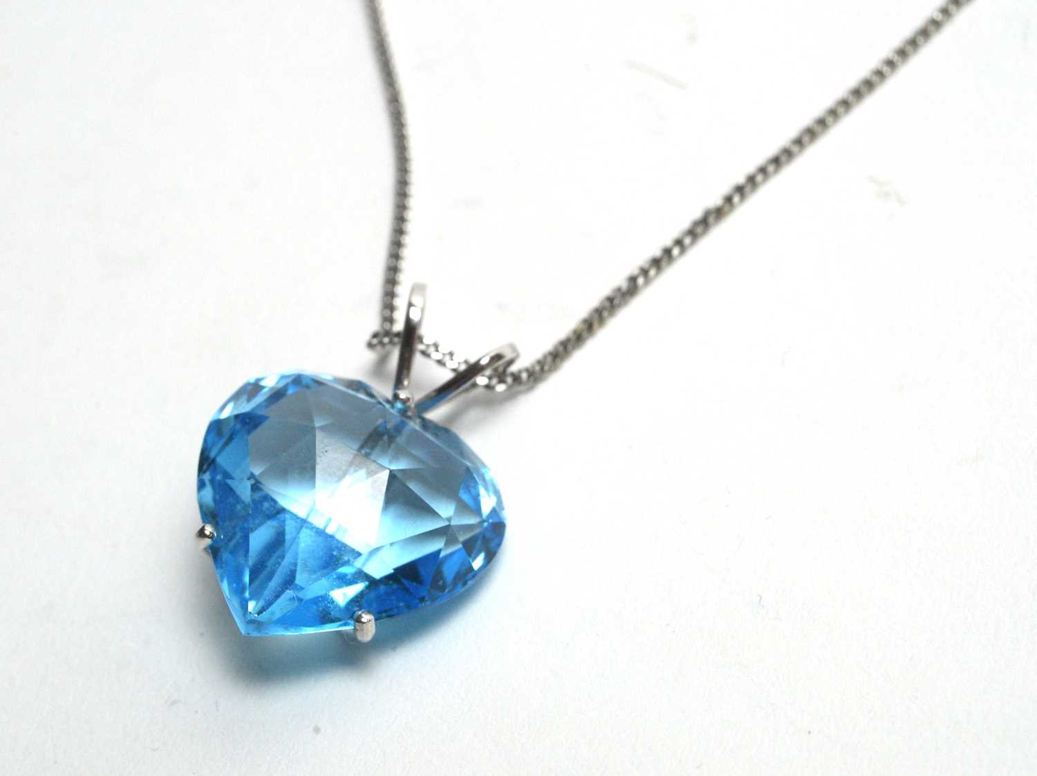 Lot 26 - A heart shaped blue topaz pendant