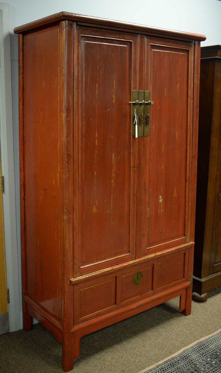 Lot 110 - Early 20th C red lacquer Chinese wardrobe.