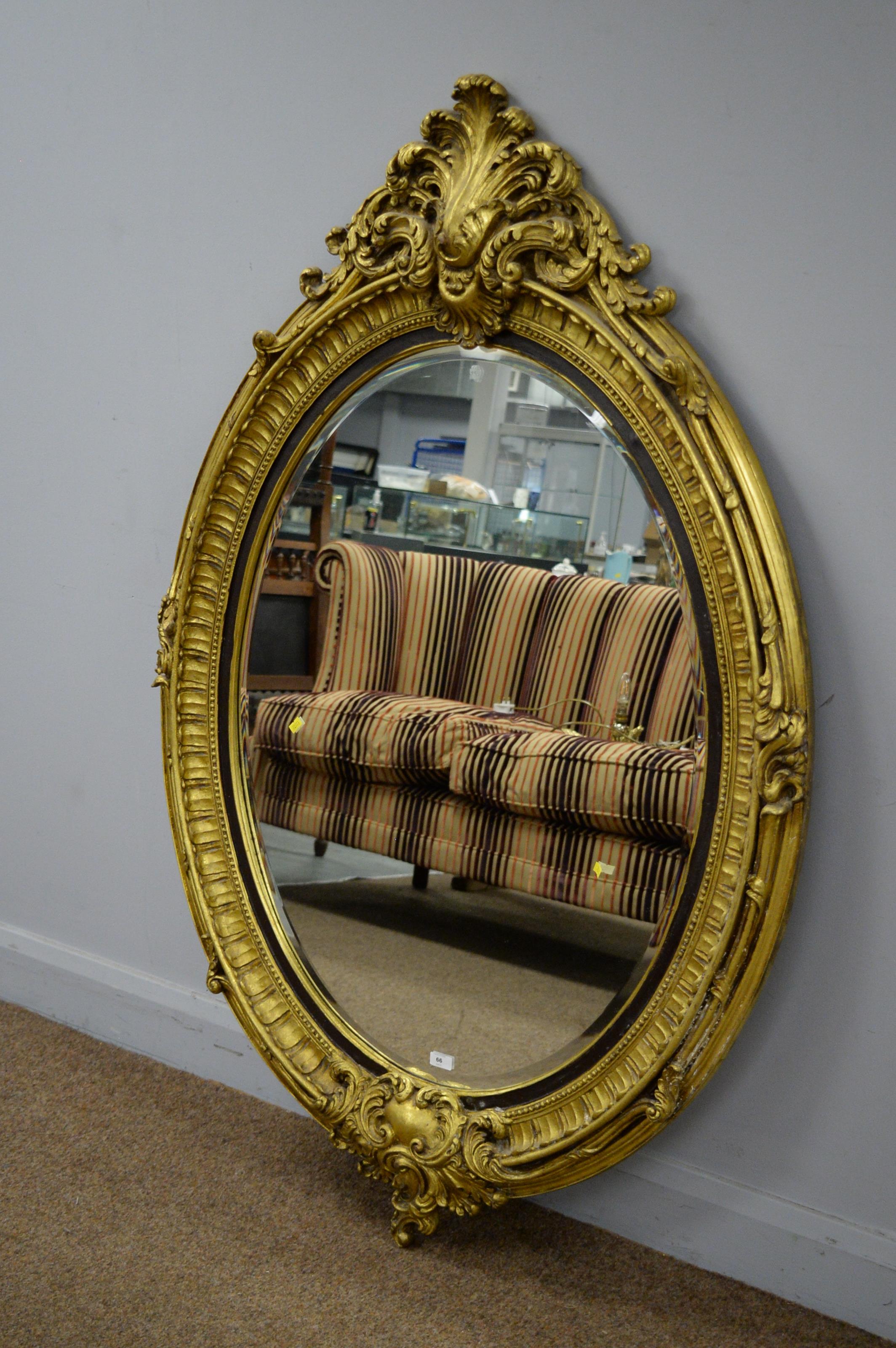 Lot 66 - A large and ornate rococo style gold painted