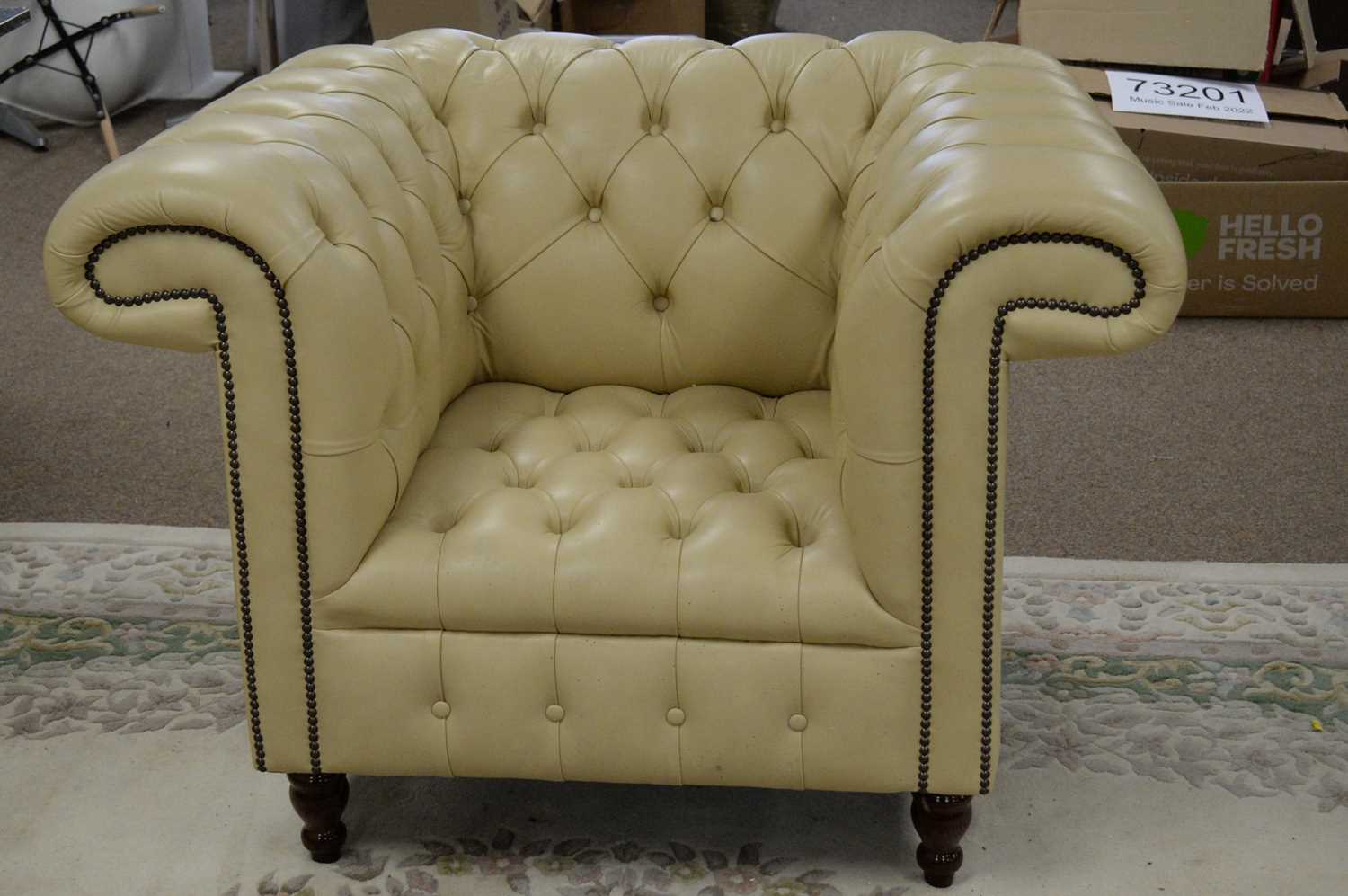 Lot 53 - A modern cream Chesterfield style sofa and a