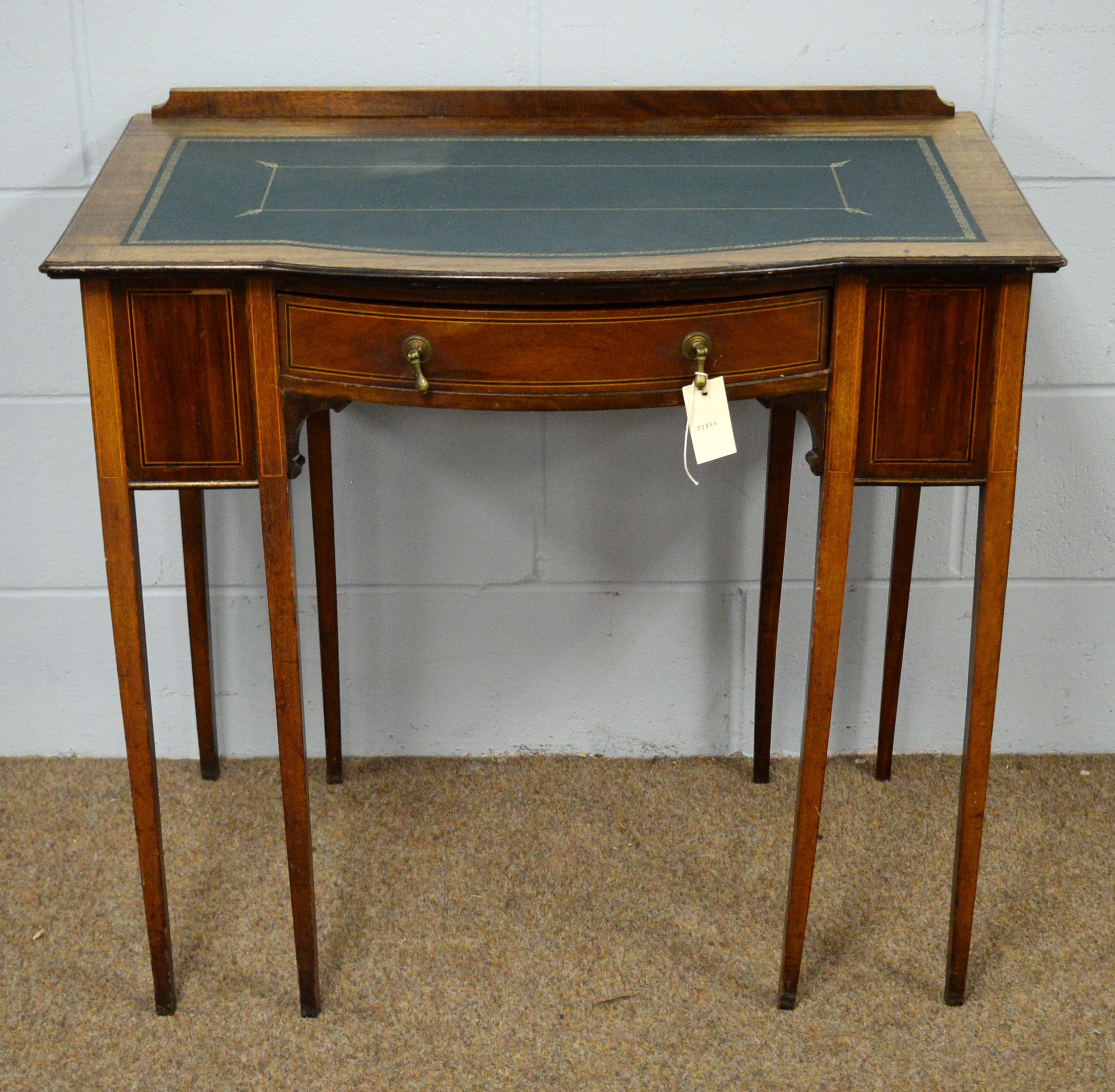 Lot 16 - An Edwardian inlaid mahogany desk.