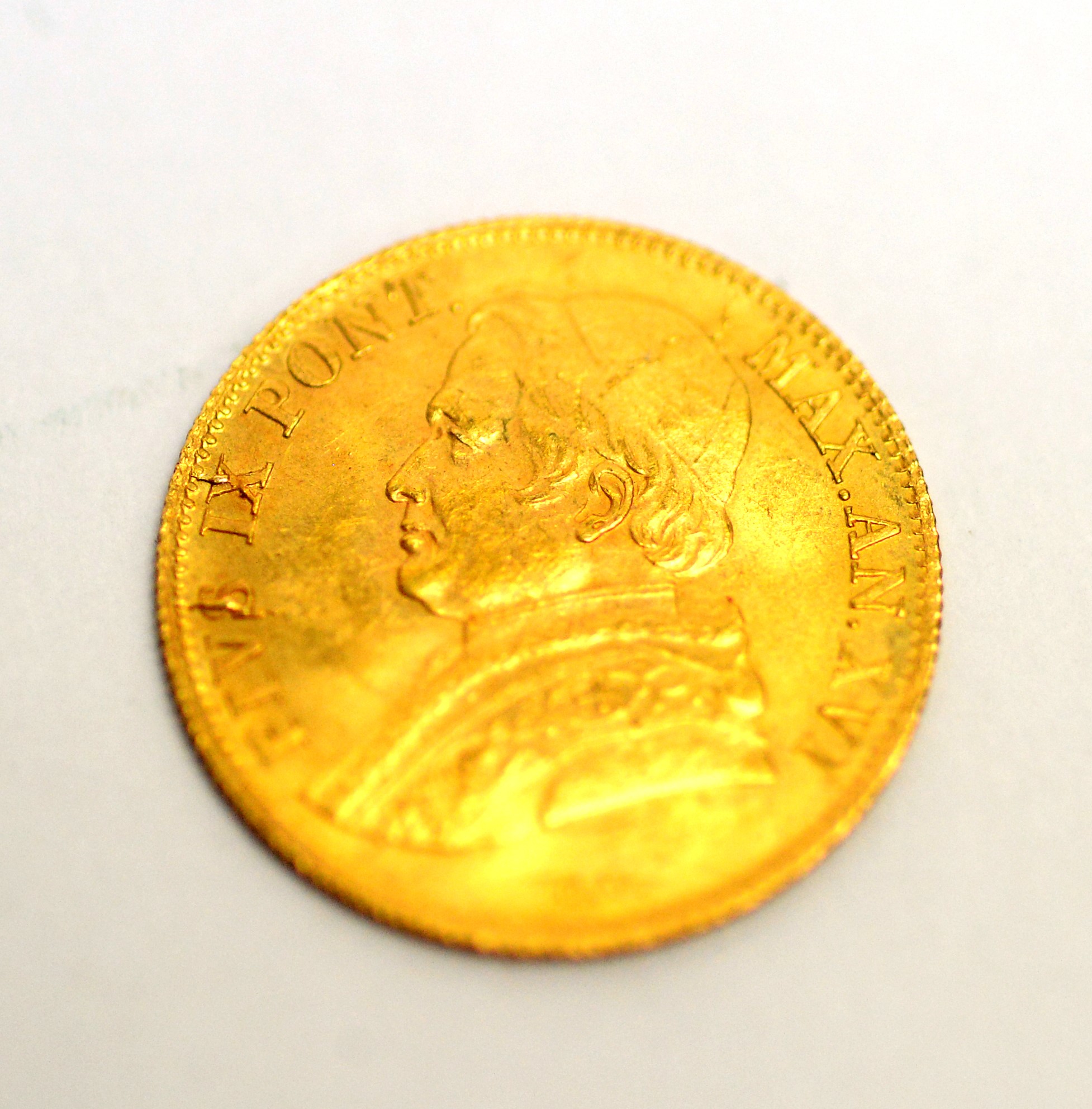 Lot 150 - A Pope Pius 1 Scudo gold coin, 1862; and two