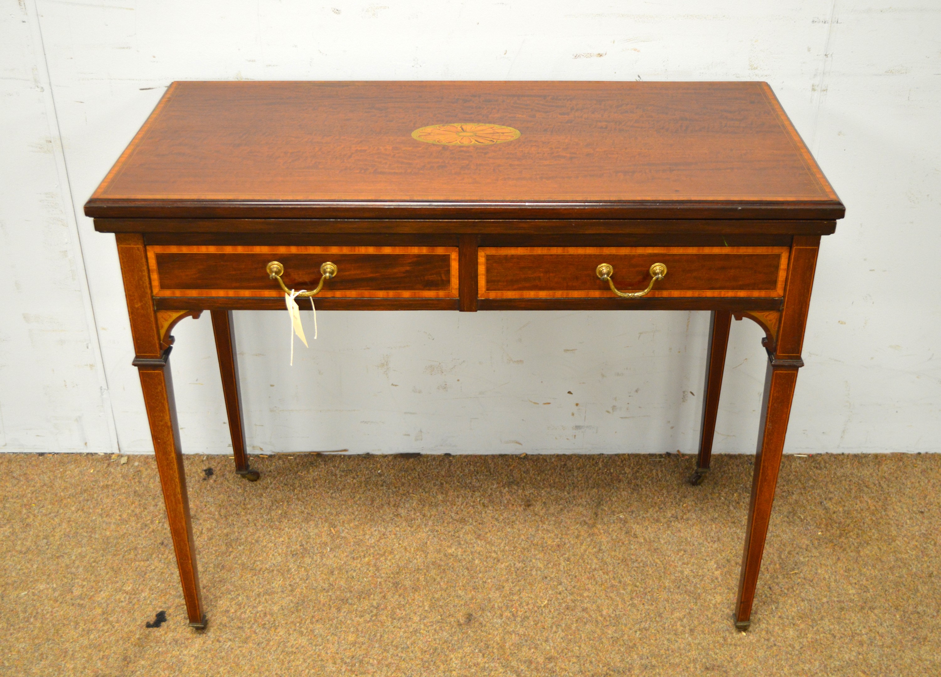 Lot 3 - An Edwardian card table.