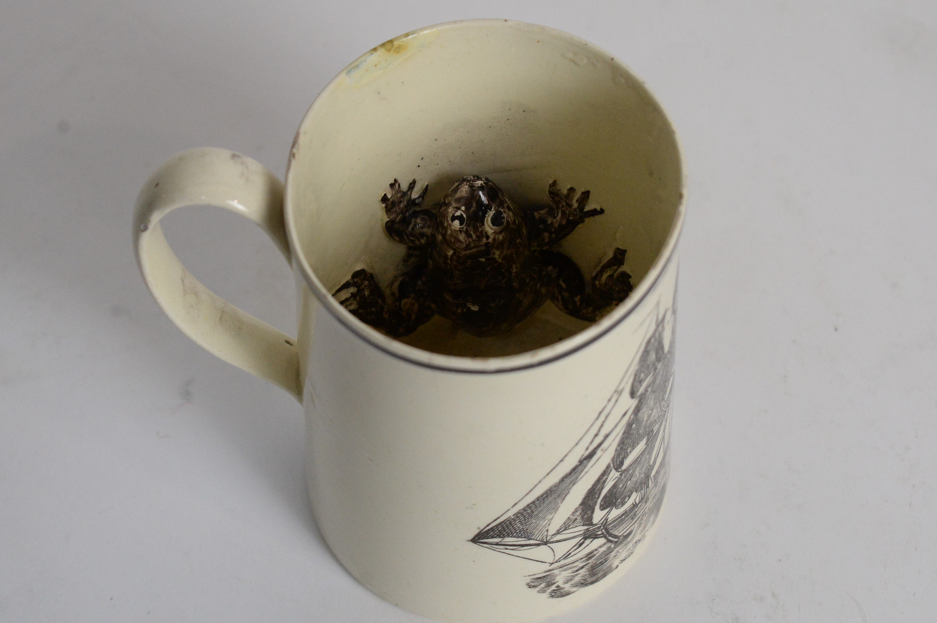 Lot 731 - Newcastle Pottery Creamware frog mug, and a