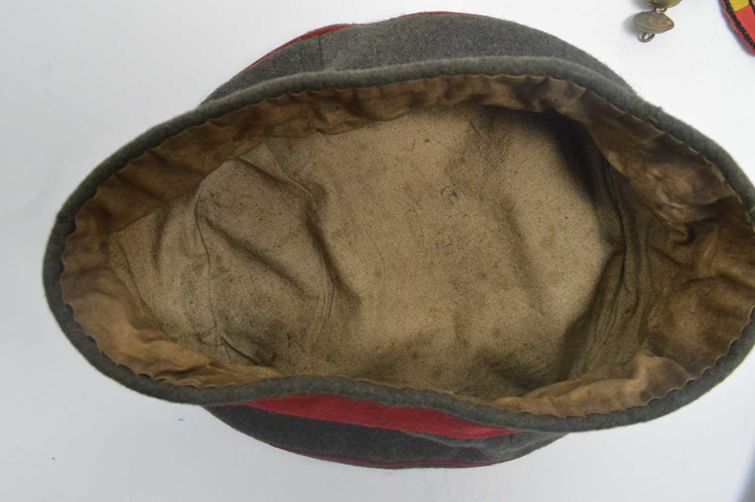 Lot 671 - German WWI cloth cap; cap badges, buttons