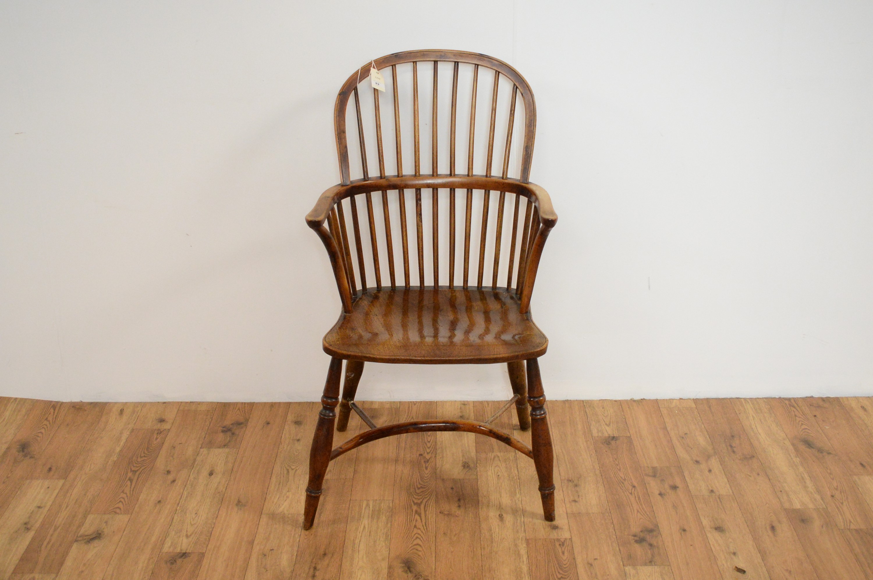 Lot 23 - A 19th Century yew and elm comb back Windsor