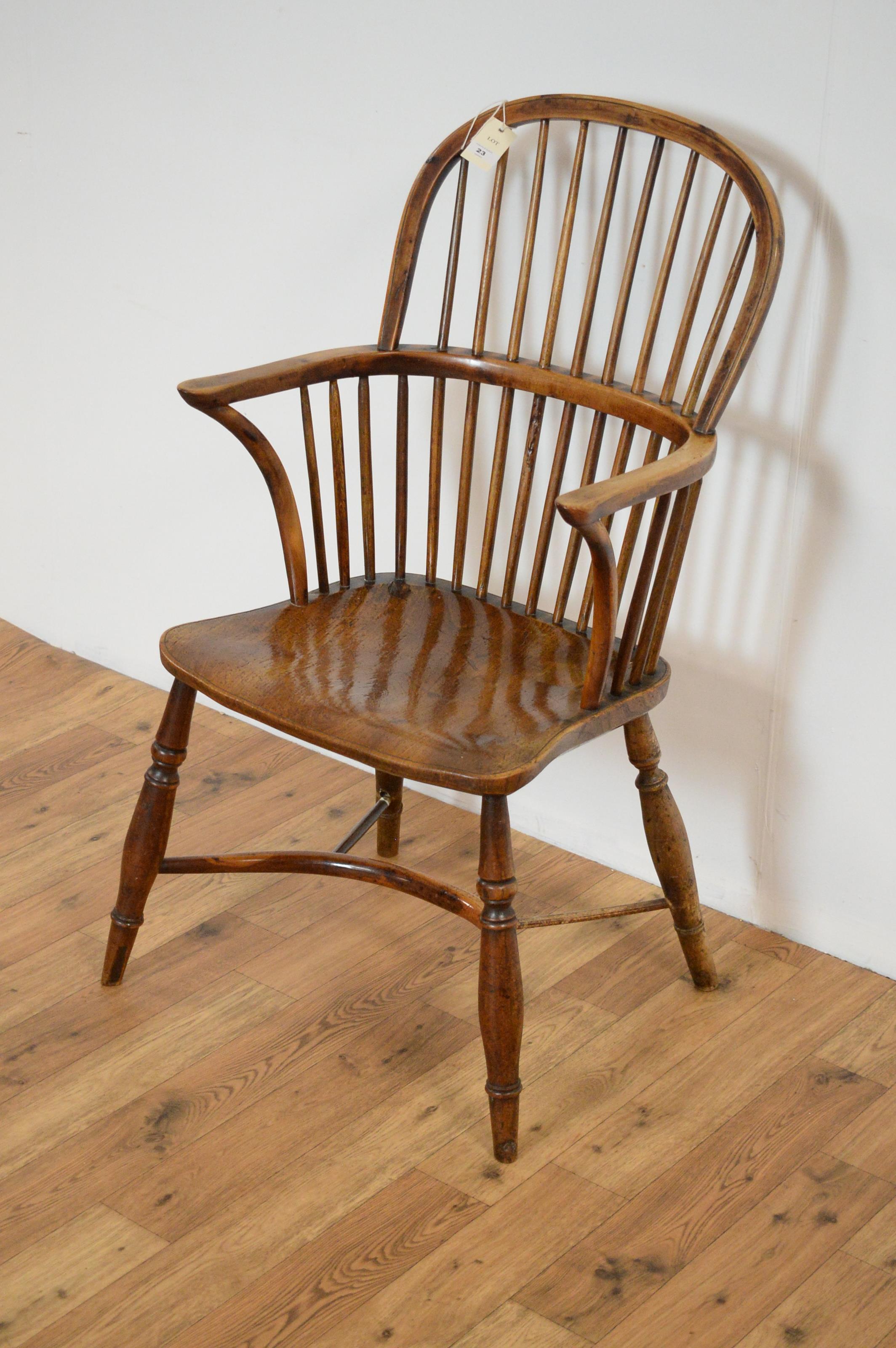 Lot 23 - A 19th Century yew and elm comb back Windsor