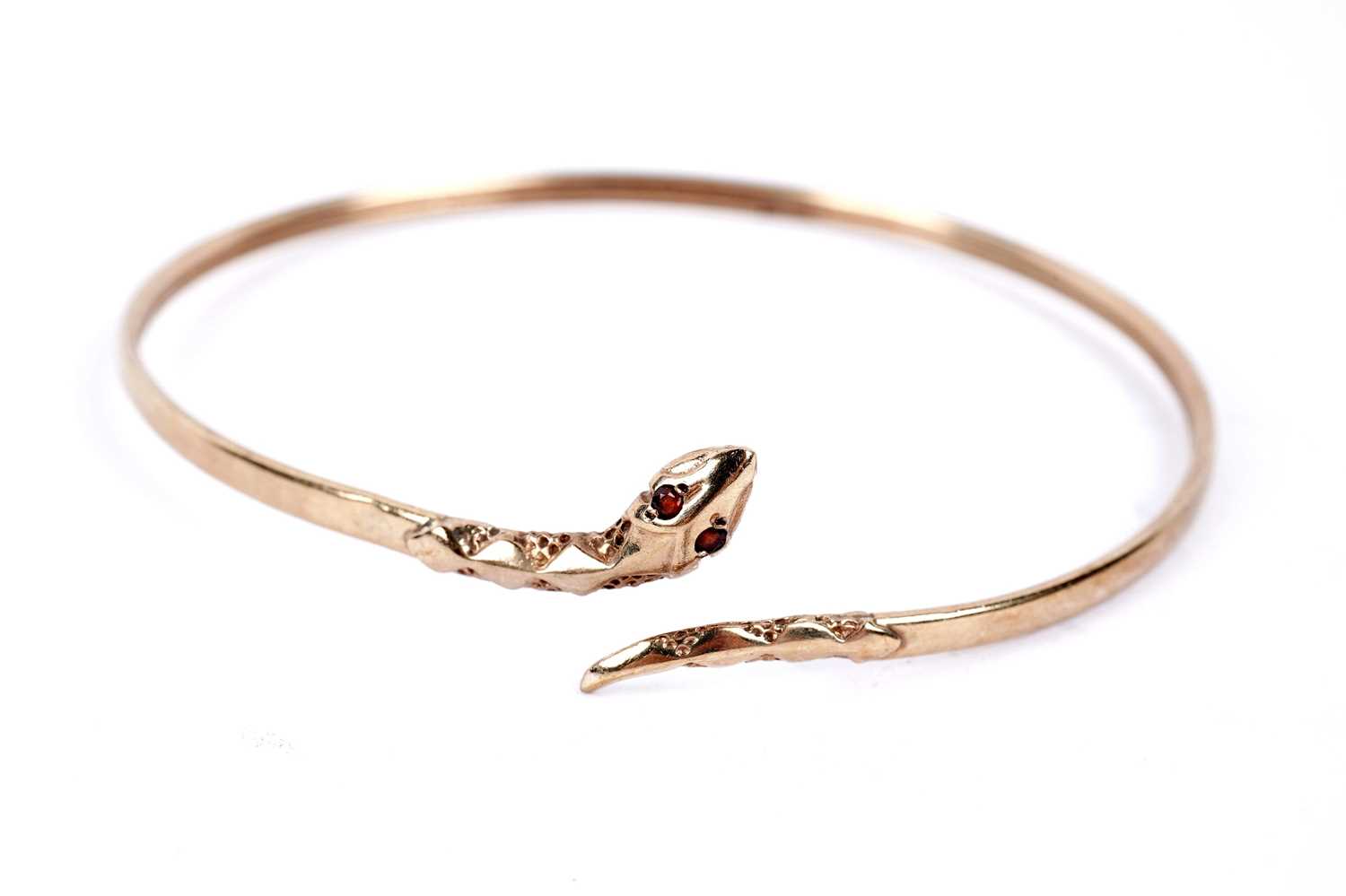 Lot 45 - A 9ct yellow gold snake pattern bangle