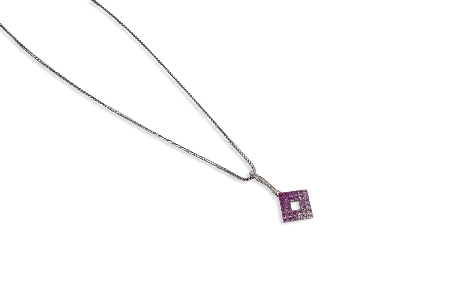 Lot 685 - A modern design pink sapphire and diamond