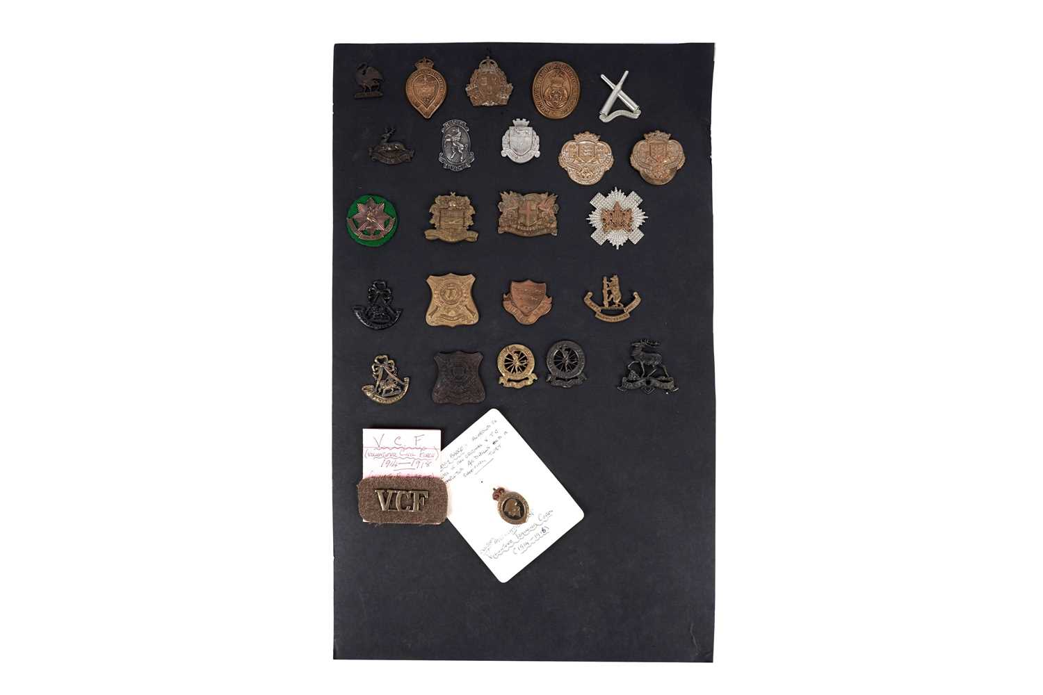 Lot 3 - A display of Volunteer Training Corps cap