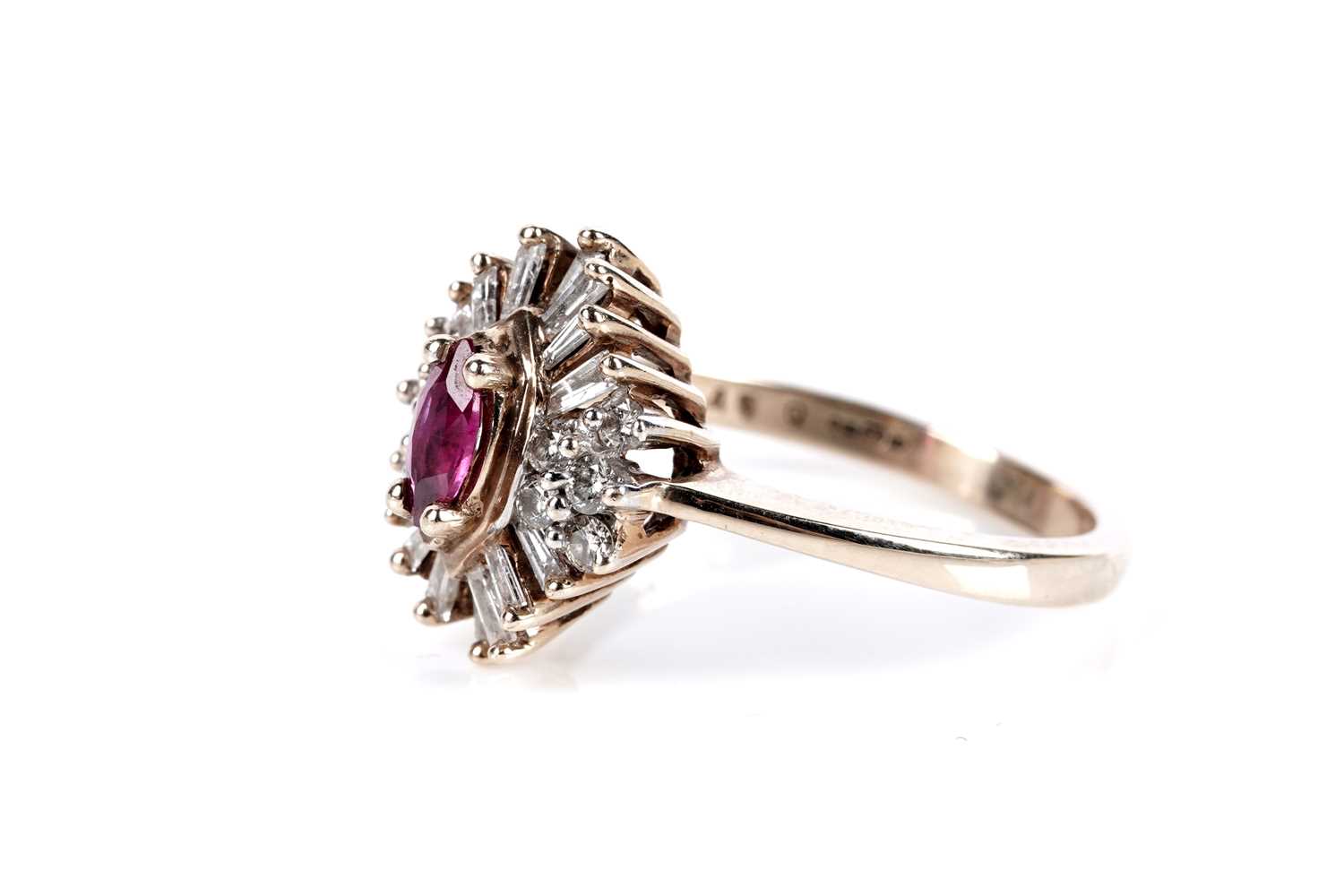 Lot 660 - A ruby and diamond cluster ring