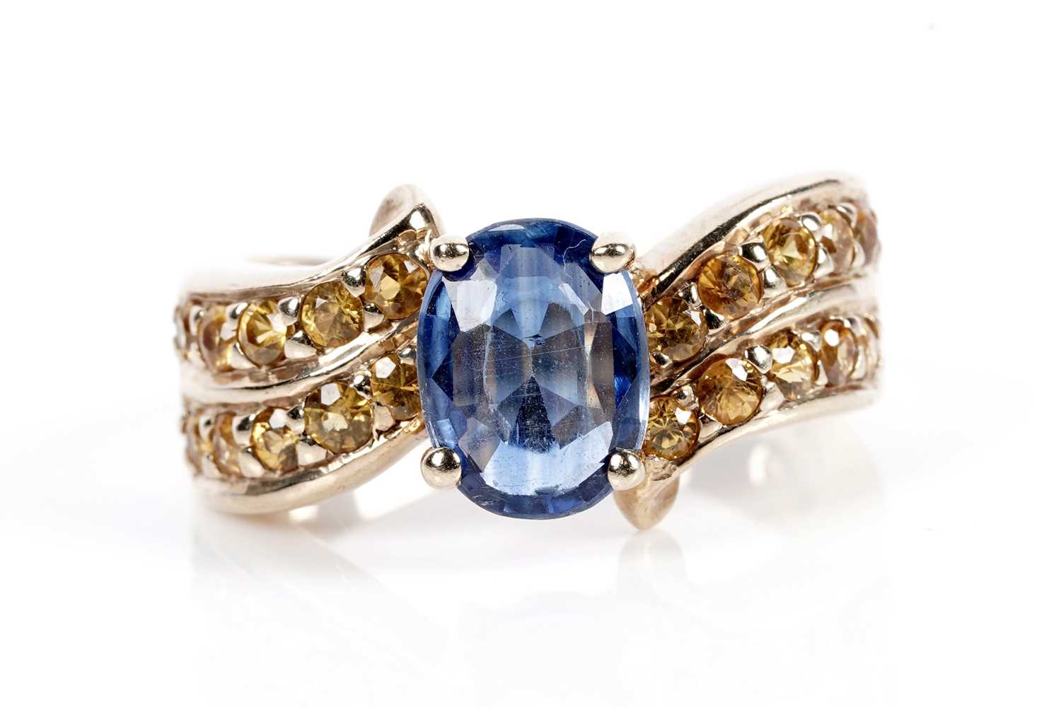 Lot 36 - A contemporary blue and yellow spinel ring in