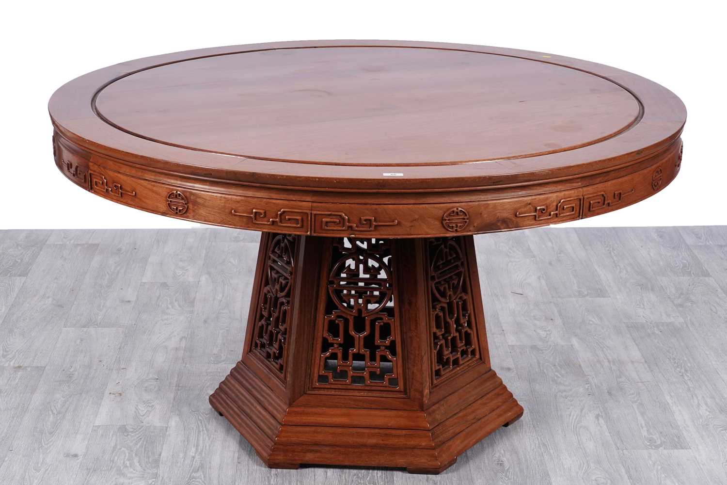 Lot 65 - A Chinese 'Ming' style hardwood dining table